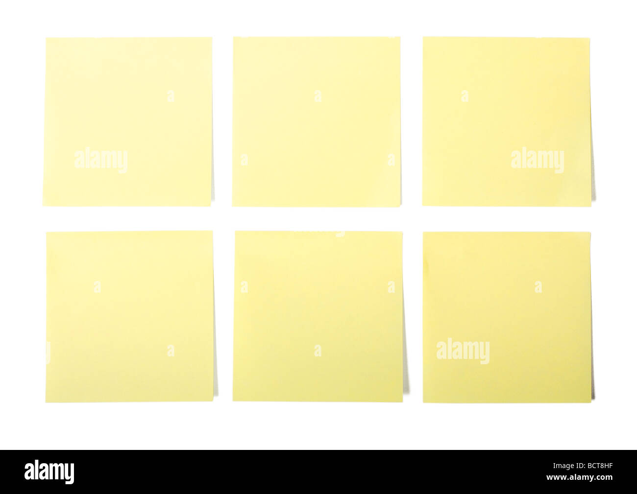 Yellow post it note on white background Stock Photo - Alamy