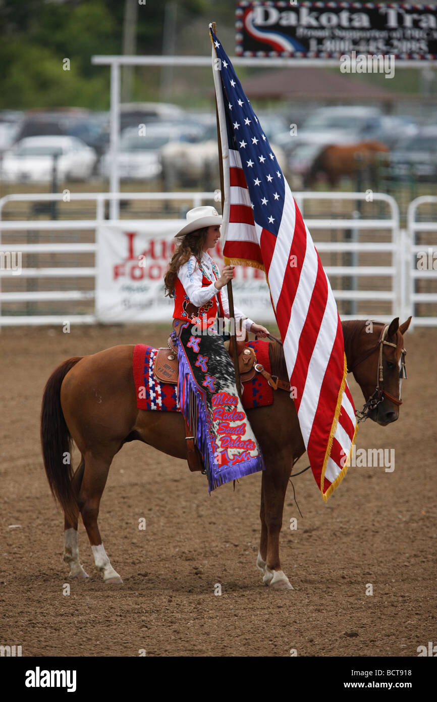 Courtney Smith, Miss Rodeo South Dakota, presents the American flag ...