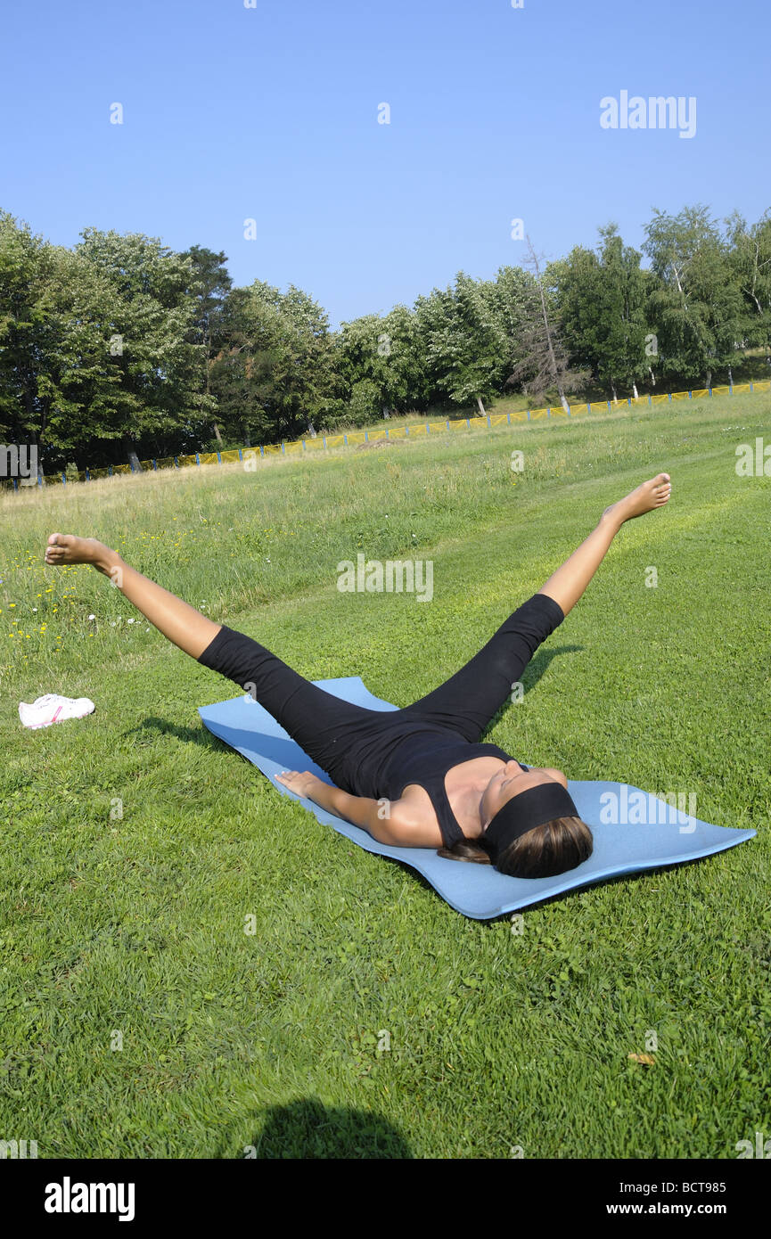 Girl Doing Advanced Stretching Exercises For The Legs And Groin With Feet Elevated Third
