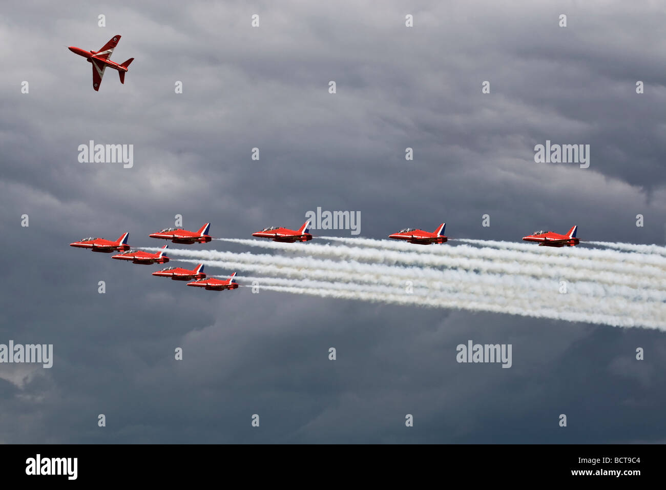 The RAF Red Arrows aerobatic team low level run and break Stock Photo ...