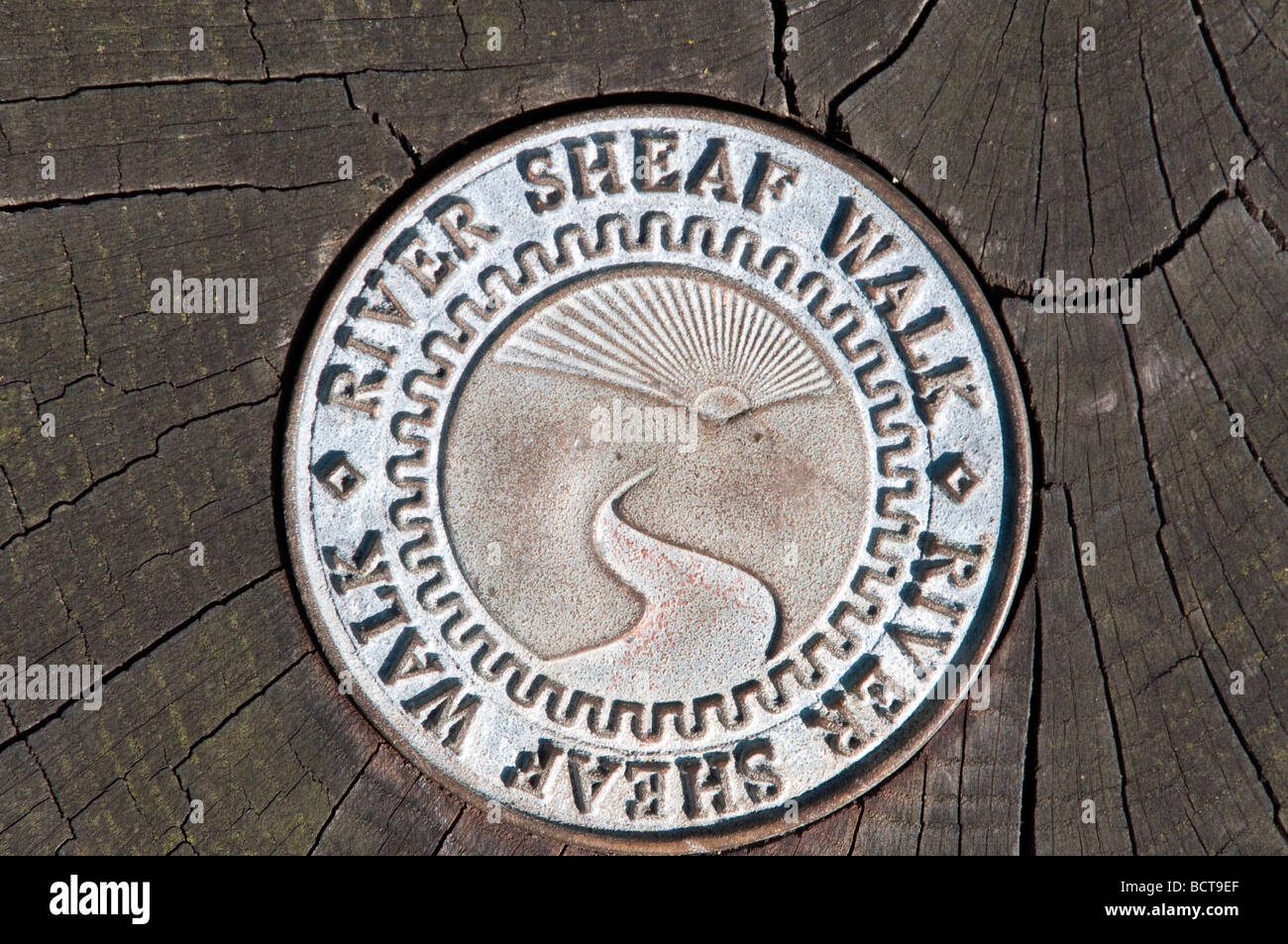 Waymarker embedded in a wooden post marking the route of the "River ...