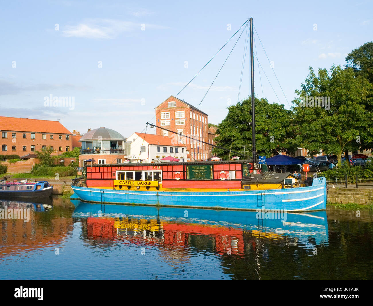Buildings and boats reflected in the River Trent, Newark ...