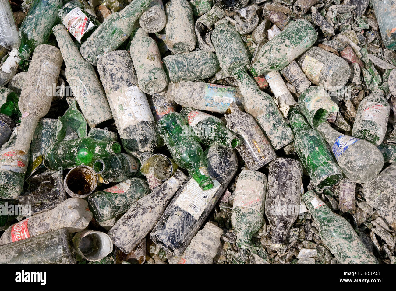 Bottles broken in public recycling materials Stock Photo - Alamy