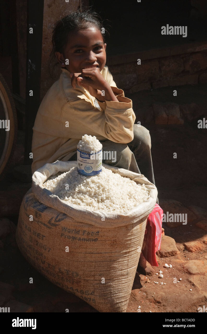 young girl selling rice in the market in Antisirabe Madagascar Stock ...