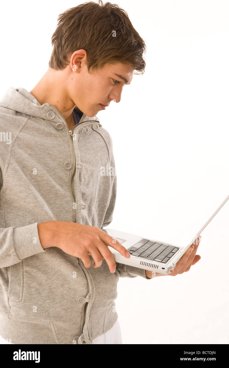 Boy working on his laptop Stock Photo - Alamy