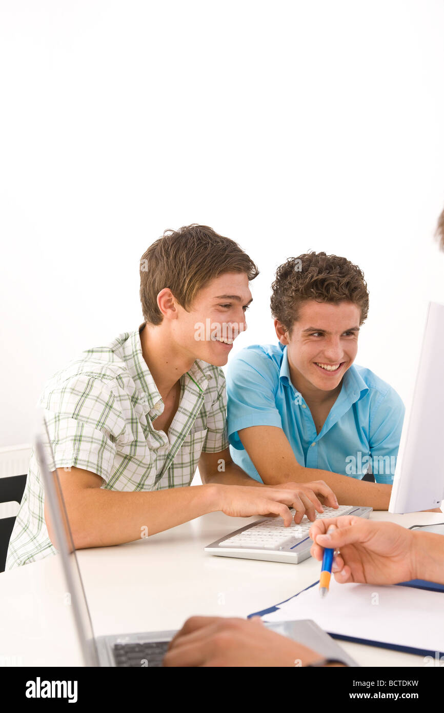 Three boys doing homework together Stock Photo - Alamy