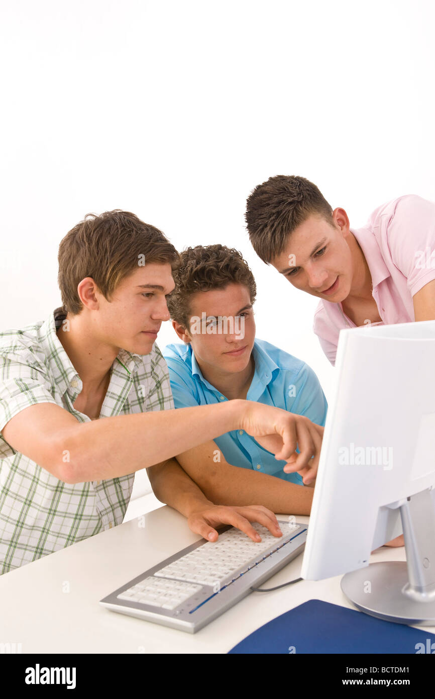 Three boys doing homework together Stock Photo - Alamy