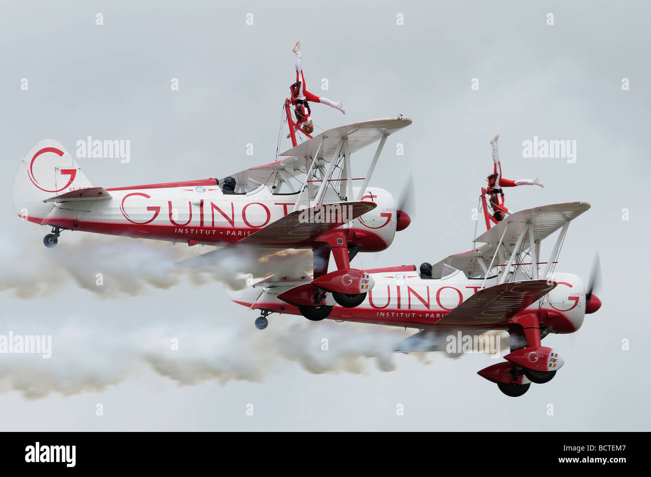 Hanging upside down on the top wing of a Boeing Stearman biplane. Team ...