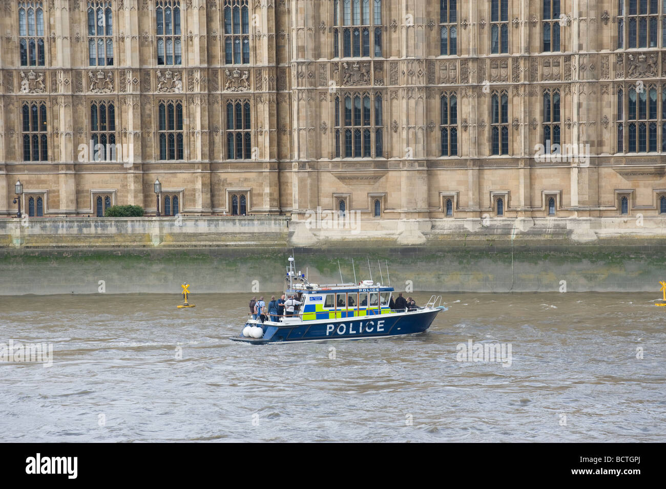 POLICE LAUNCH ON THE RIVER THAMES BELOW THE PALACE OF WESTMINSTER Stock ...