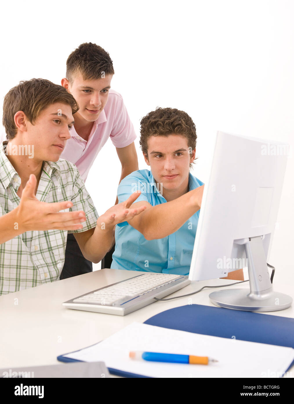 Three boys doing homework together Stock Photo - Alamy