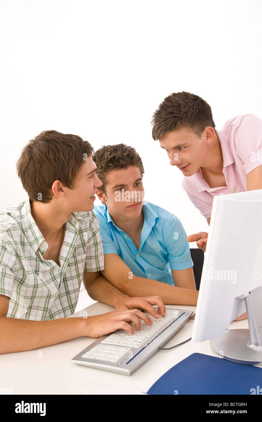 Three boys doing homework together Stock Photo - Alamy