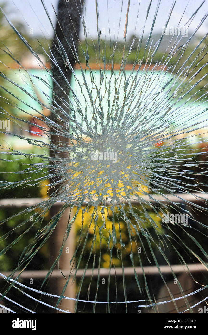 Cracked safety glass at a bus stop shelter Stock Photo - Alamy