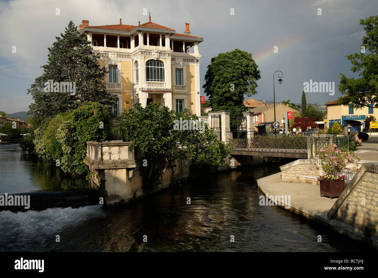 Rainbow above Sorgue River, in the village Ile sur la Sorgue, Provence ...