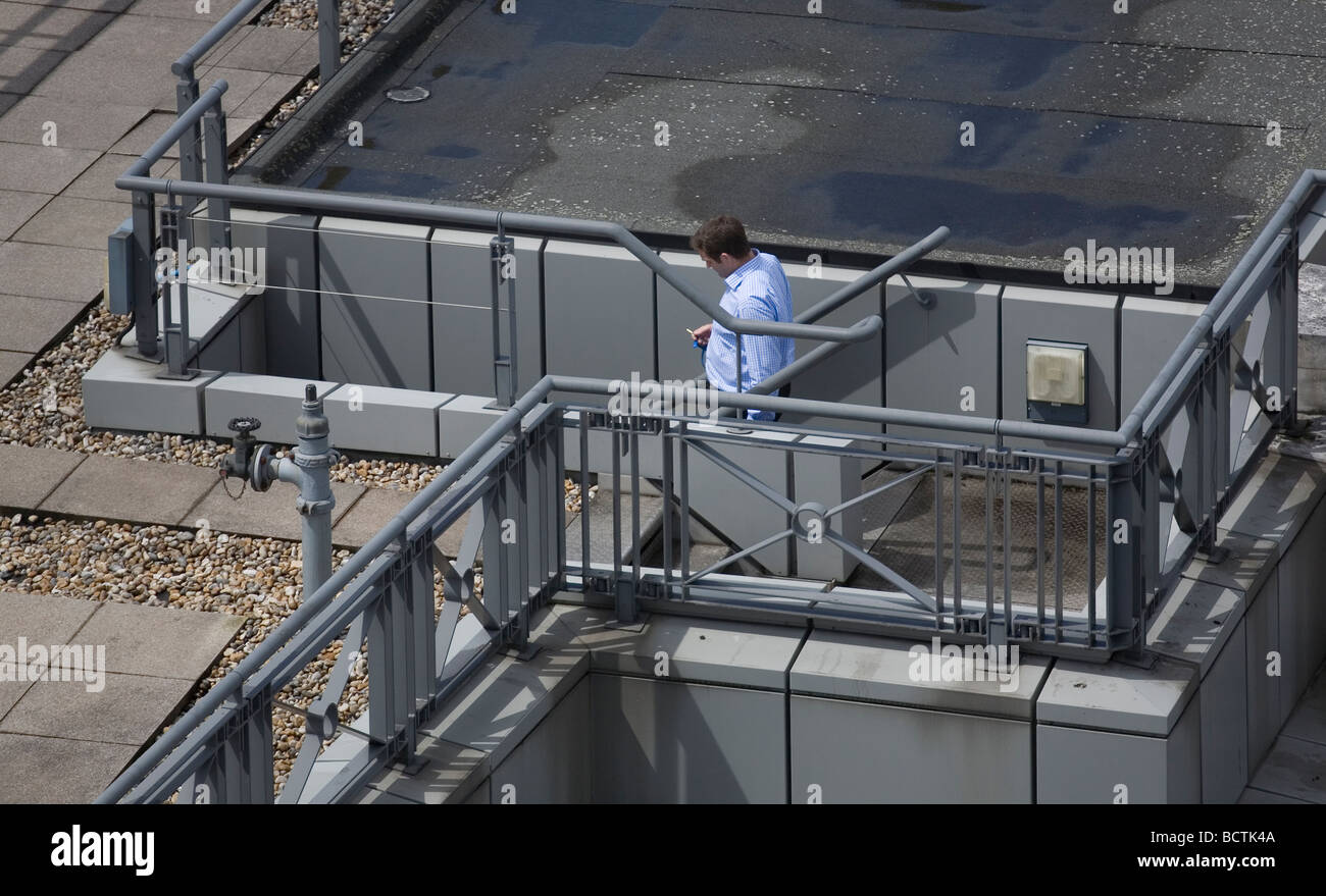 Man on a roof hi-res stock photography and images - Alamy