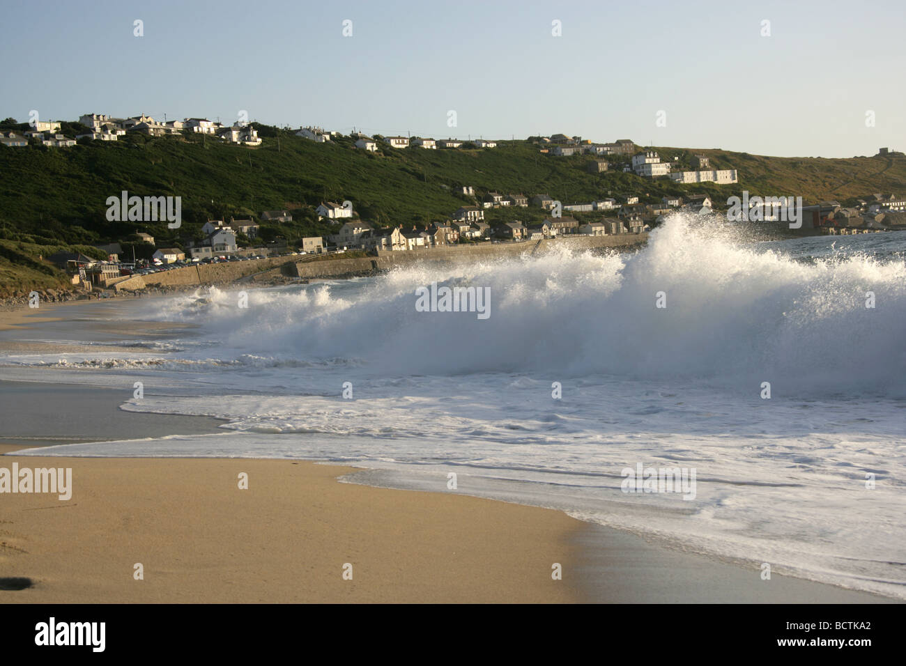 Area of Sennen, England. Late afternoon view of waves breaking on ...