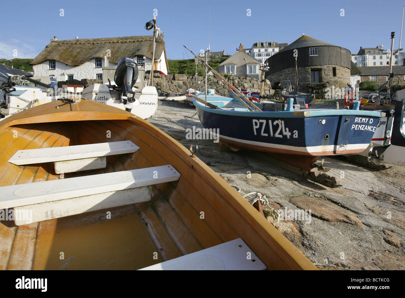 Area of Sennen, England. Fishing boats at Sennen Cove Harbour with the ...