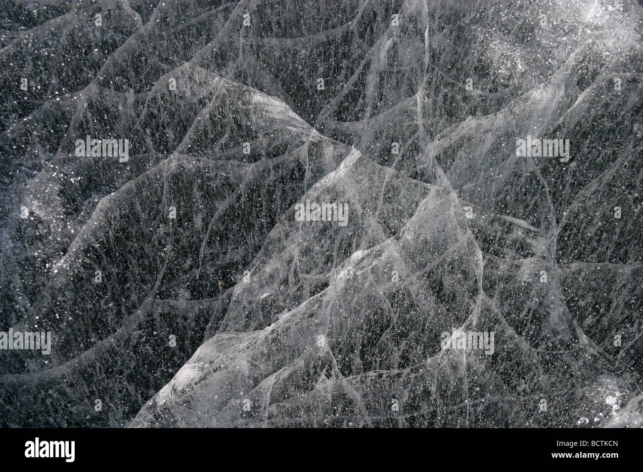 patterns in frozen lake ice Stock Photo - Alamy
