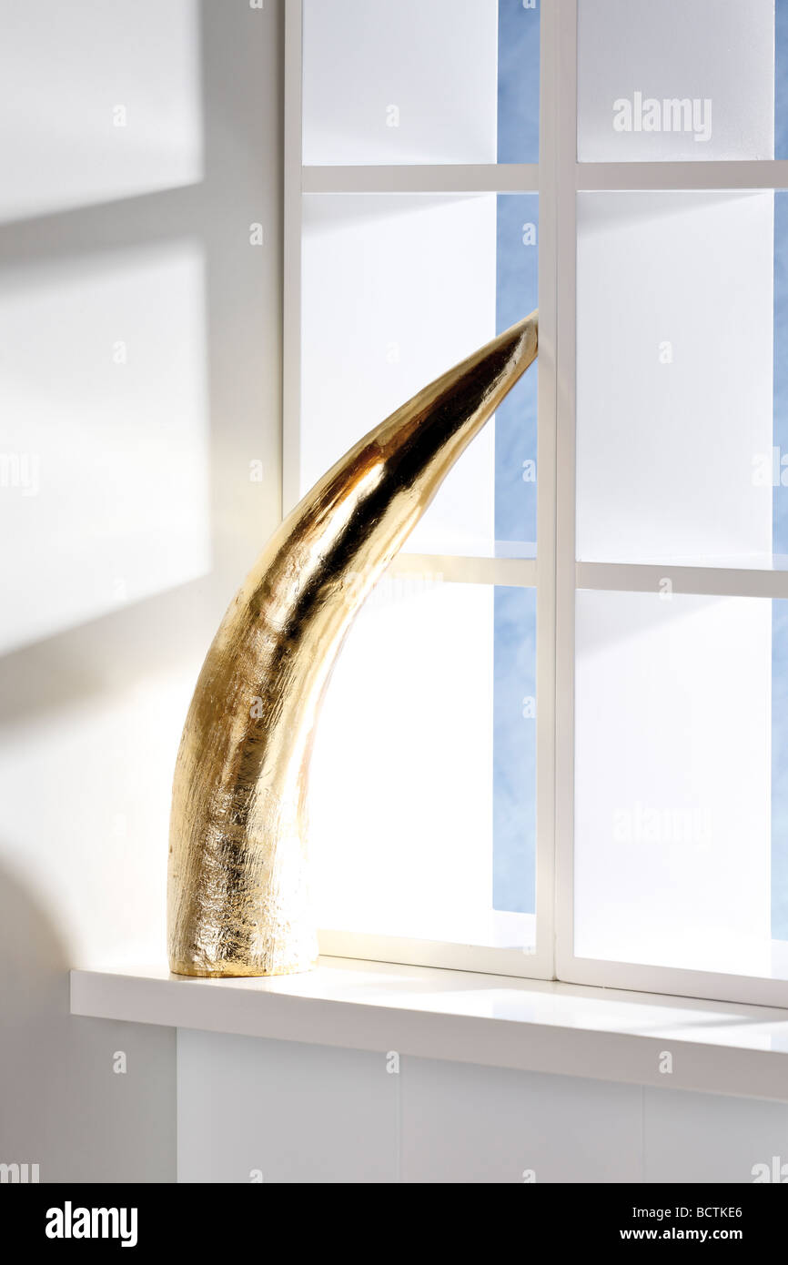 Golden cornucopia on a windowsill Stock Photo - Alamy