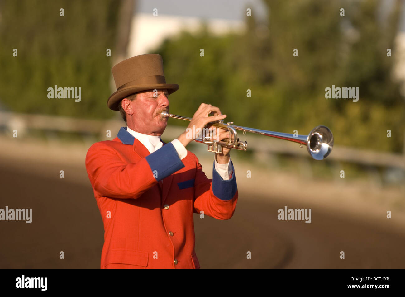 A bugler playing his bugle at the Los Alamitos Race Track in Los ...