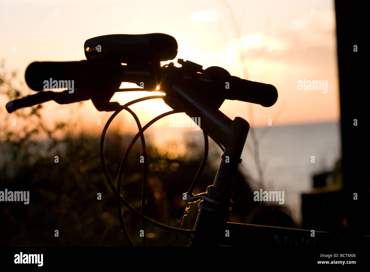 Bicycle beach sunset hi-res stock photography and images - Alamy