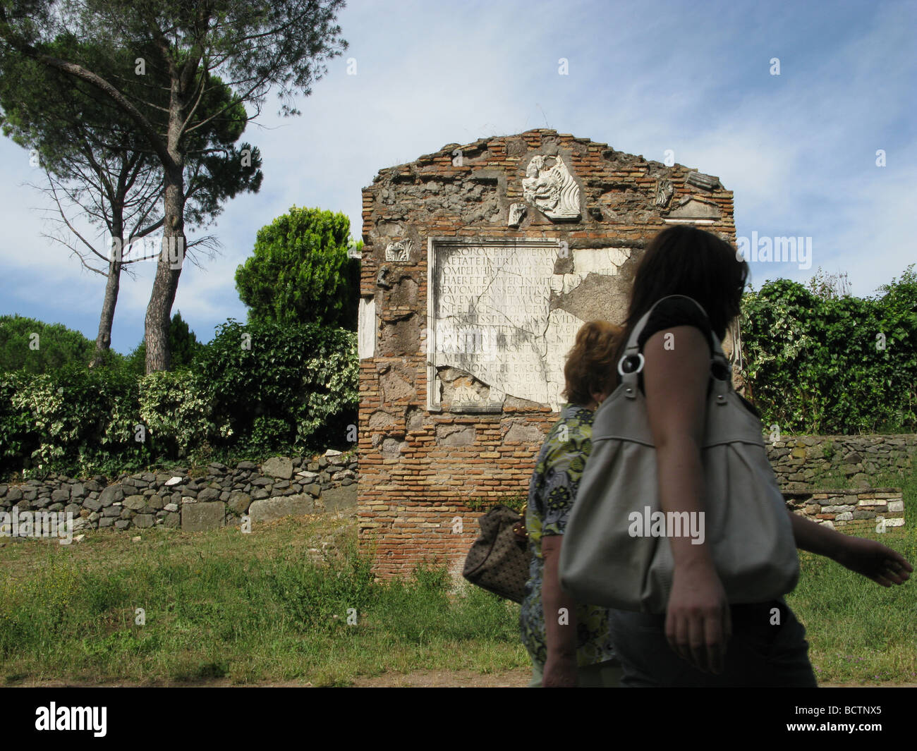 people walking on the ancient roman old appian way, rome, italy Stock ...