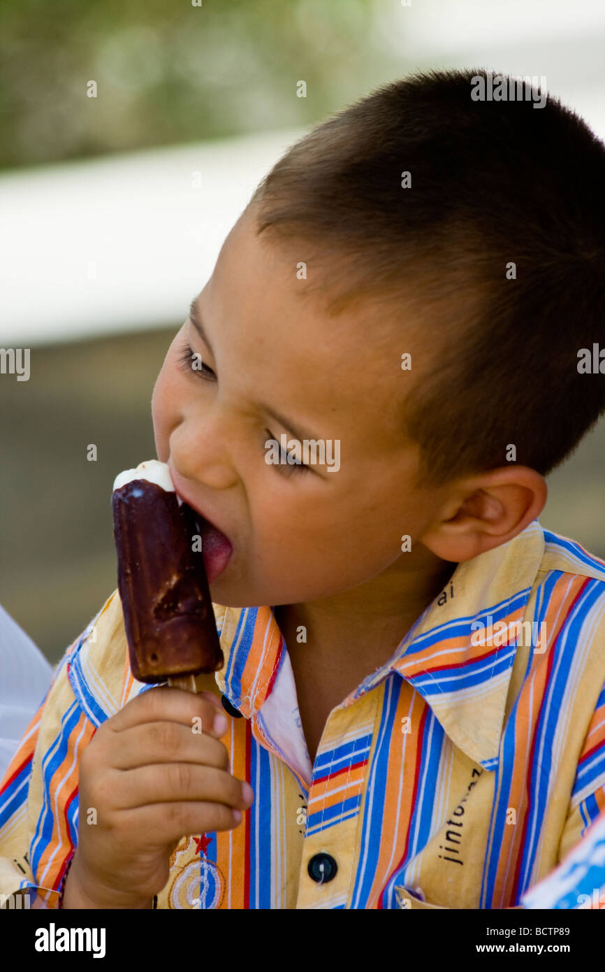 Young Turkmen Boy Eating Ice Cream in Mary Turkmenistan Stock Photo - Alamy