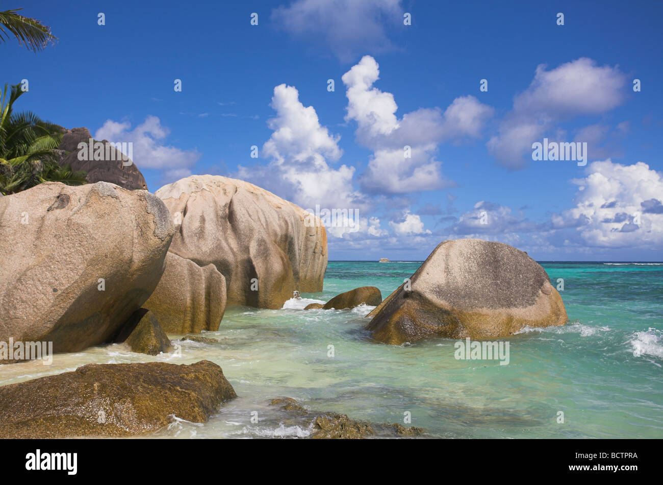 Coastal landscape of white, sandy beach, granite rocks and crystal blue ...