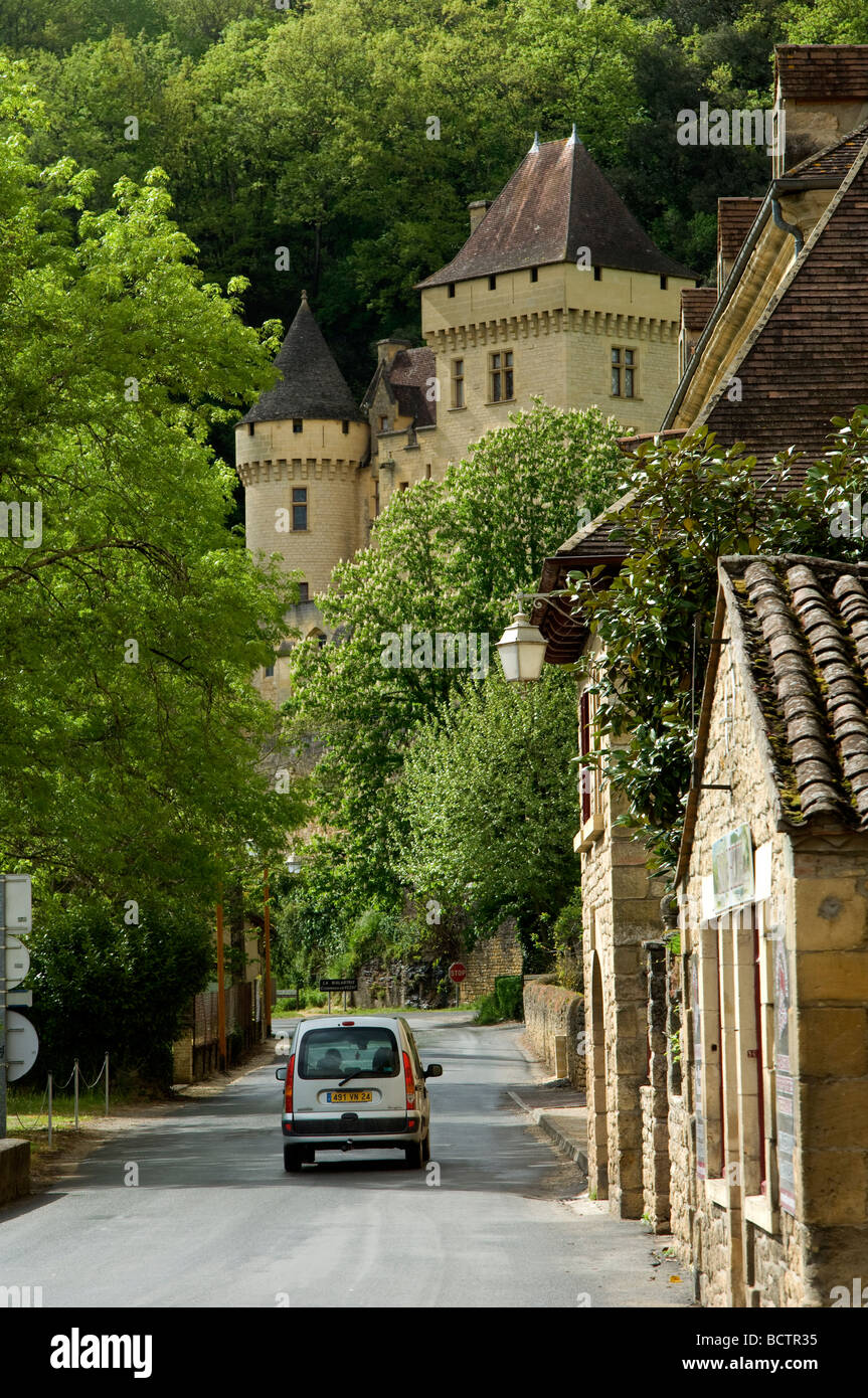 Car Driving in Hillside Town Stock Photo - Alamy