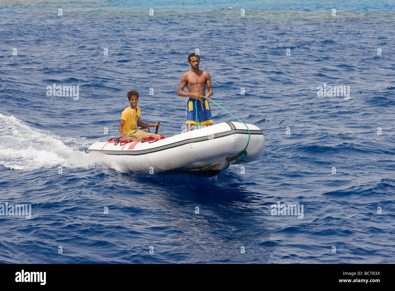 Two young adults rinding in an inflatable raft Stock Photo - Alamy