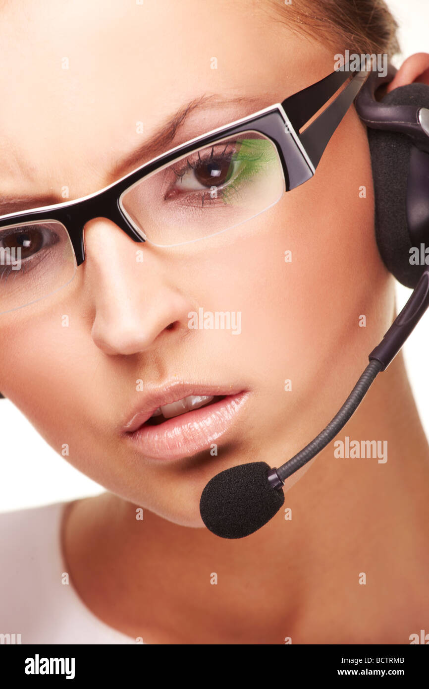 A nice and smiling hotline operator with headset Stock Photo - Alamy