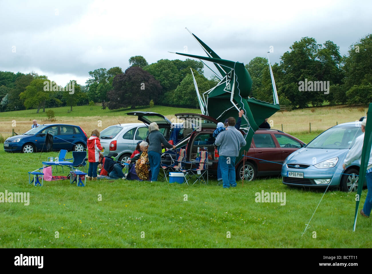 A Gazebo overturned due to wind during a picnic Stock Photo - Alamy