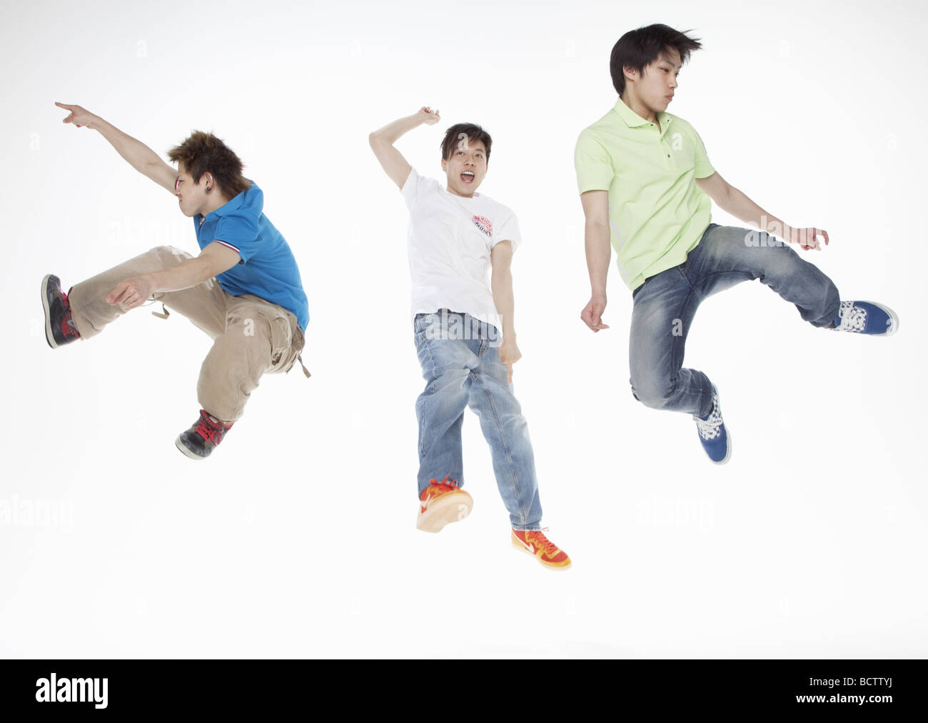 Young men jumping Stock Photo - Alamy