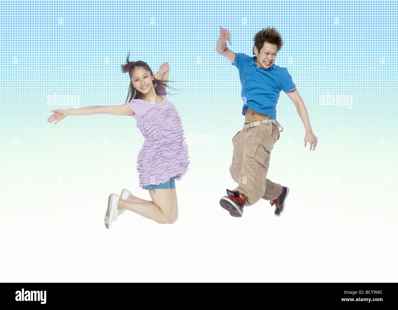 Young couple jumping Stock Photo - Alamy