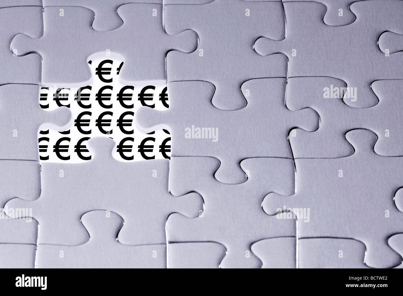Jigsaw puzzle with Euro signs Stock Photo - Alamy