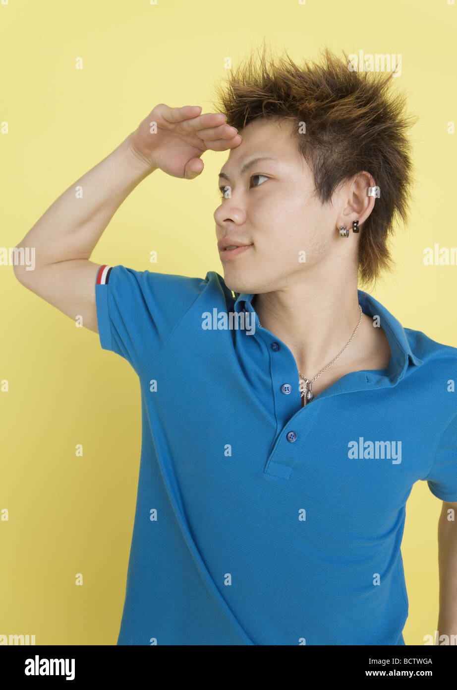 Young man looking out Stock Photo - Alamy