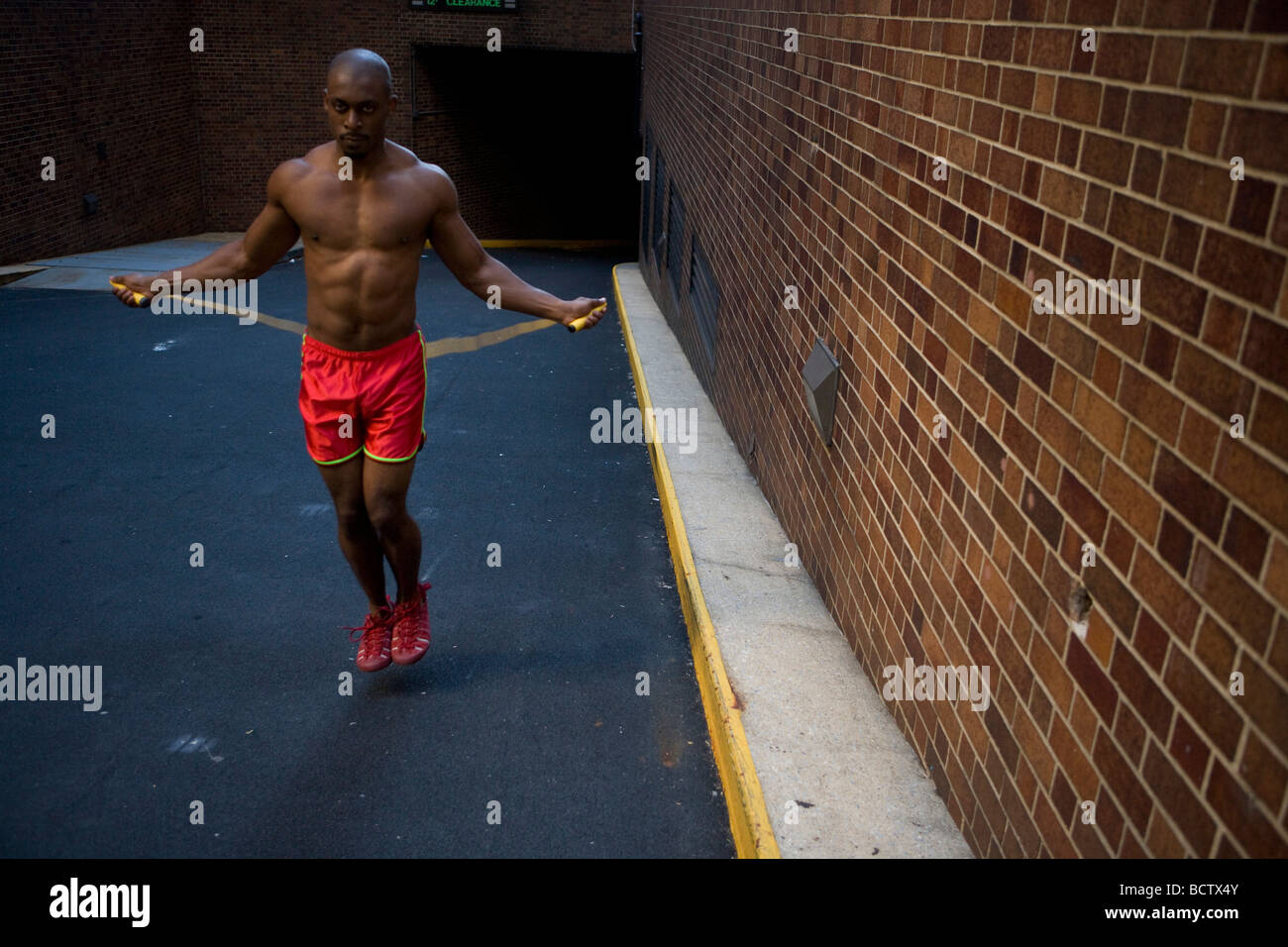 Mid adult man jumping rope Stock Photo - Alamy