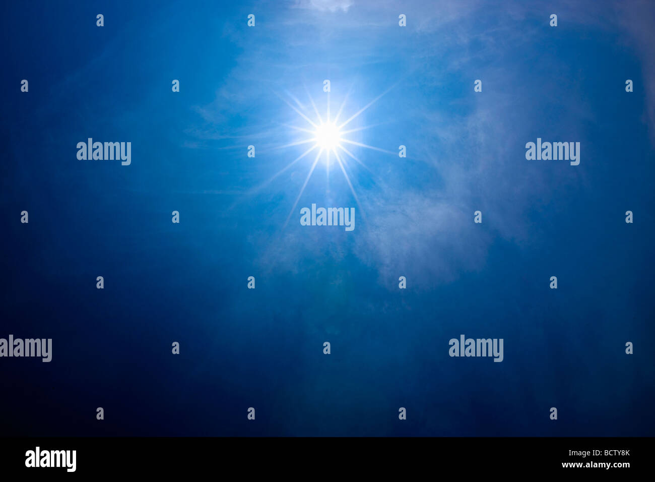 Sun in a Bright Blue Sky Stock Photo - Alamy