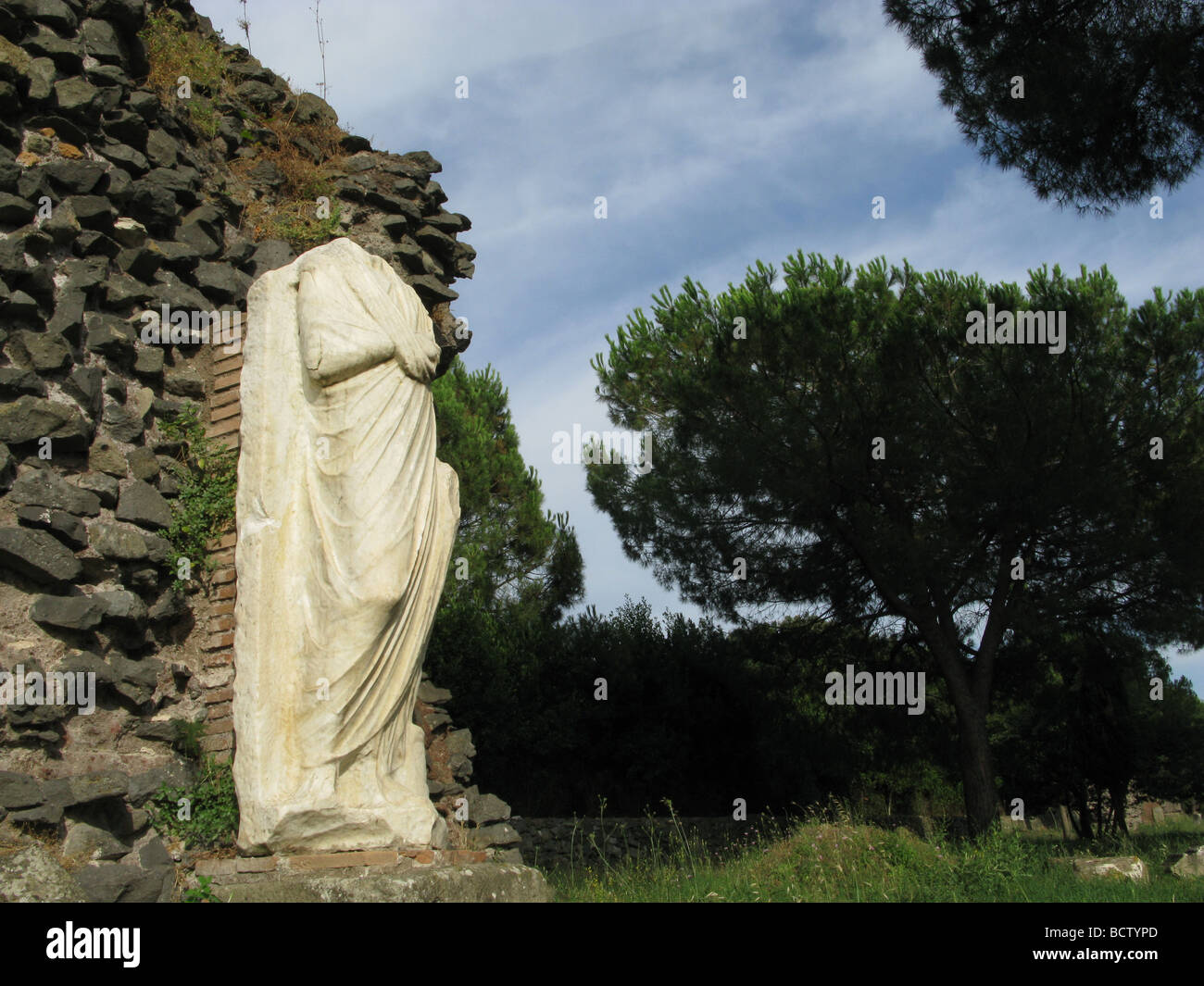 old roman statue on the old appian way in rome italy Stock Photo - Alamy