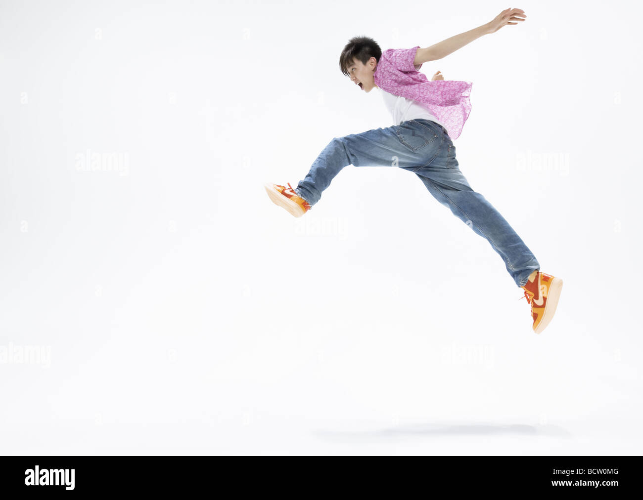 Back view young man jumping air hi-res stock photography and images - Alamy