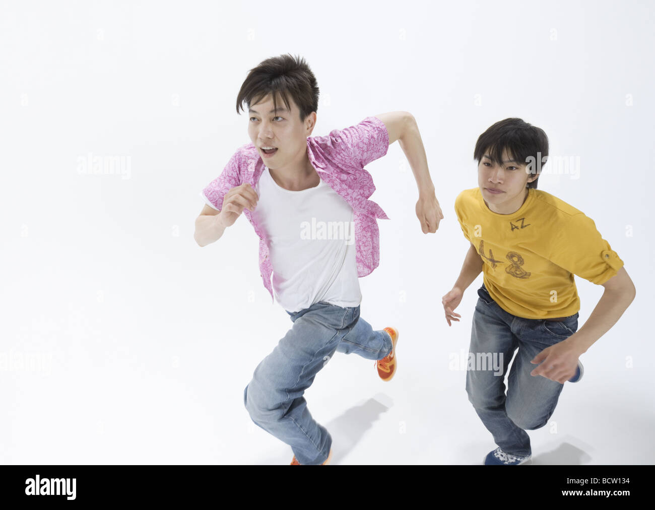 Young men making a dash Stock Photo - Alamy