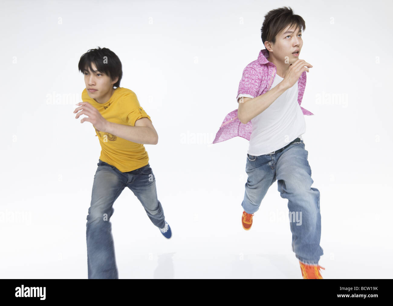 Young men making a dash Stock Photo - Alamy