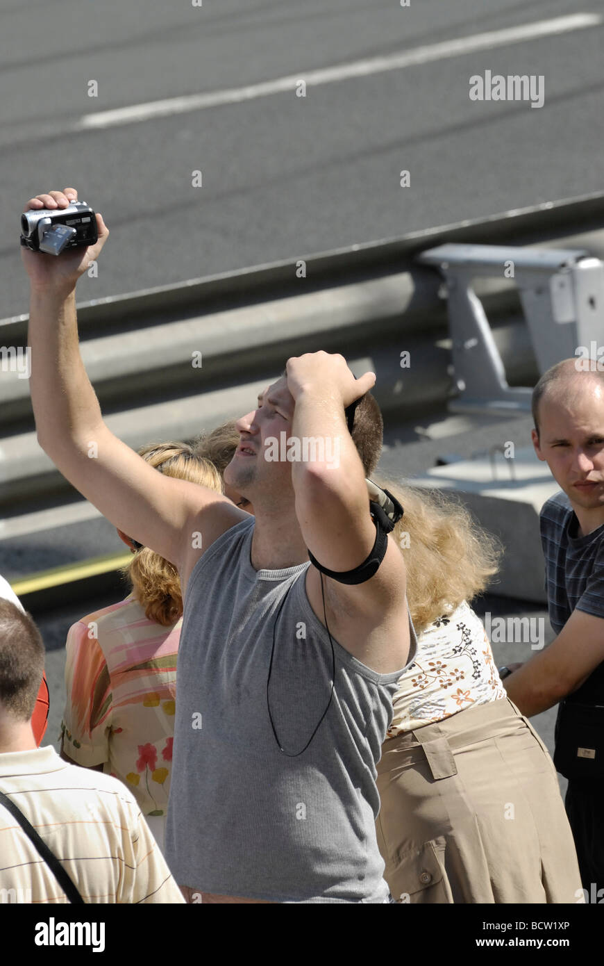 Young man with video camera Stock Photo - Alamy