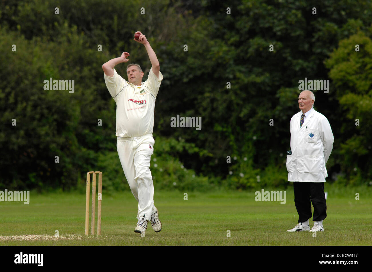 slow left-arm bowler in action Stock Photo - Alamy