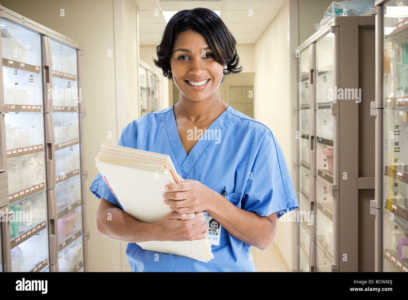 Female doctor in a storage room Stock Photo - Alamy