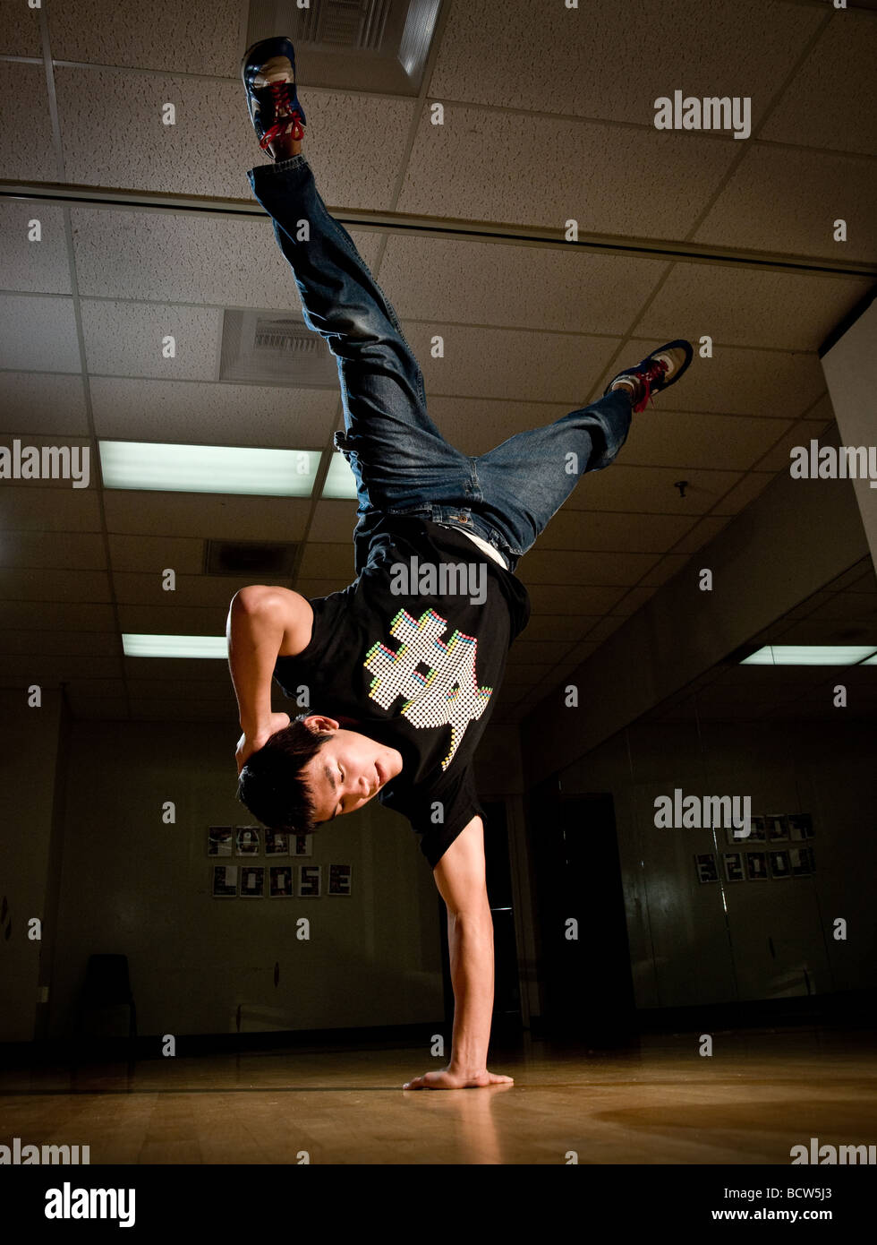 Break Dancer does a hand stand Stock Photo - Alamy