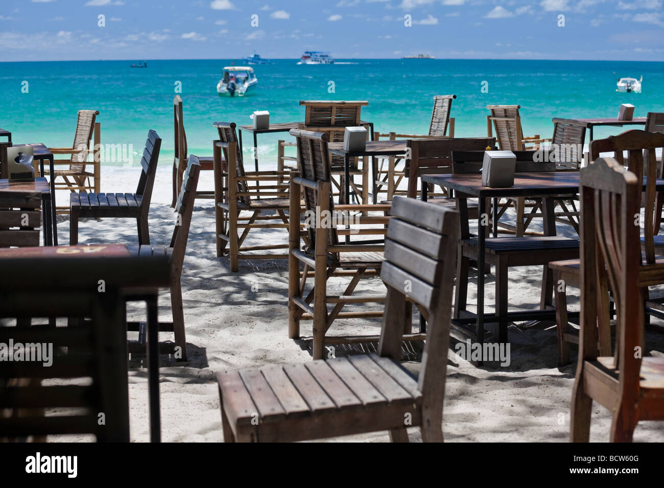 Tables with chairs at a tropical beach hi-res stock photography and ...