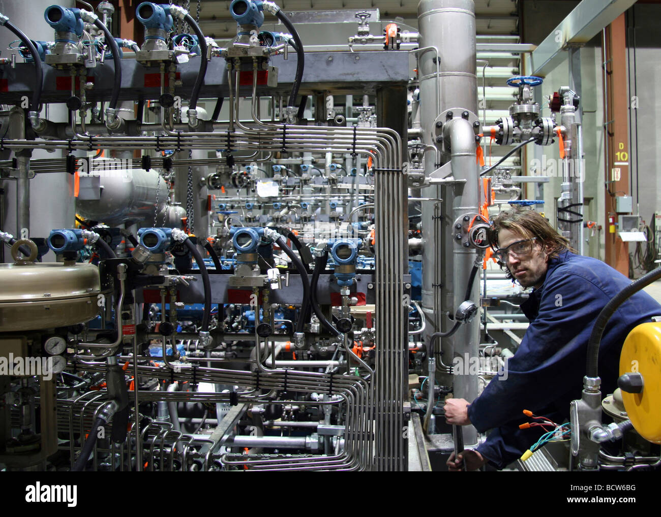 Side profile of a engineer working on a gas compressor Stock Photo - Alamy