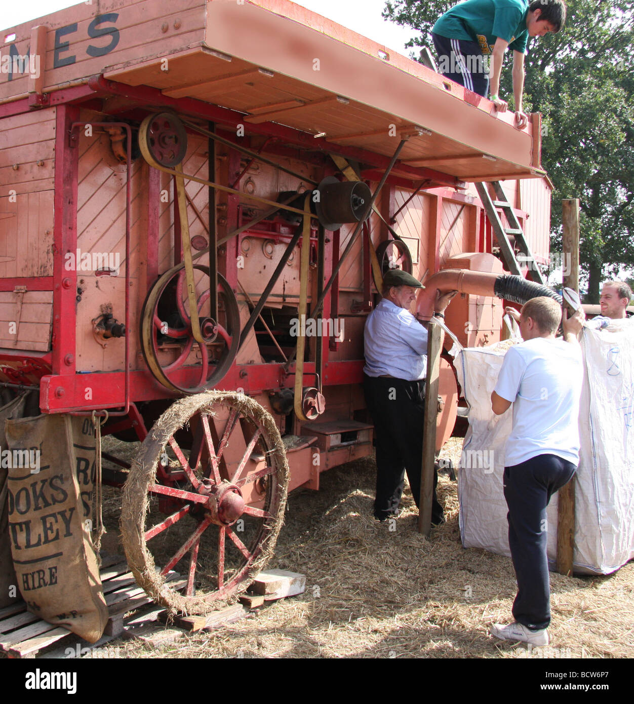 Threshing Machine Working Stock Photo - Alamy