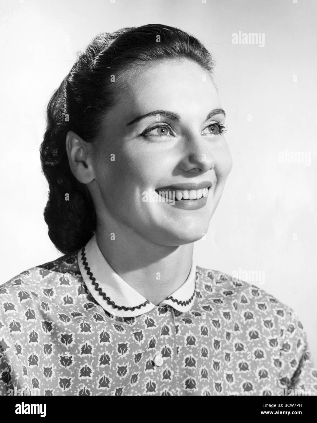 Studio portrait of mid adult woman smiling Stock Photo - Alamy