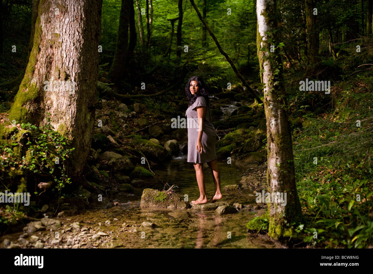 Woman in the forest Stock Photo - Alamy